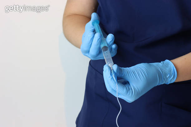 Inflating the endotracheal tube cuff with a syringe with air. Health ...