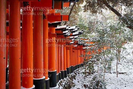 Fushimi Inari-taisha Torii Gates with snow on the roof in winter. Kyoto ...