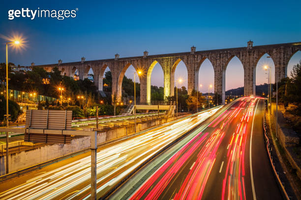 Cityscape at dusk - highway traffic near Campolide station car lights ...