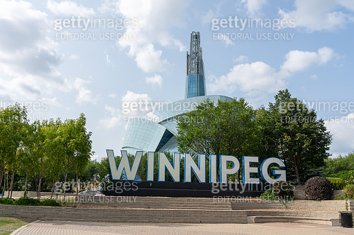 WINNIPEG Sign with Canadian Museum for Human Rights in the background ...