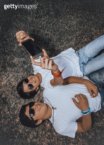 Two cute guys having fun 이미지 (1857786555) - 게티이미지뱅크