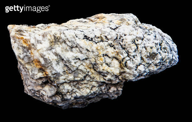Magnified close up of an igneous rock with metallic minerals in the ...