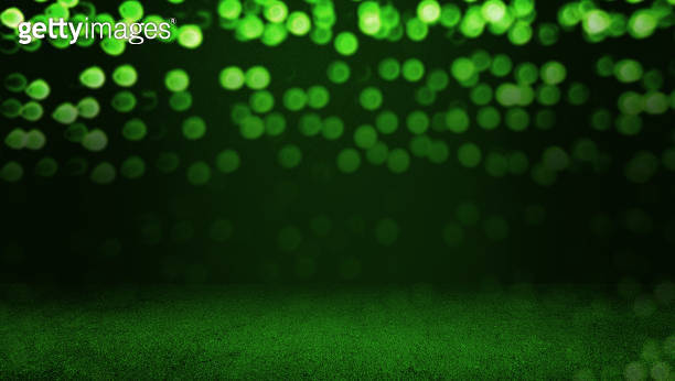 green cement floor with green light circles bokeh used for Christmas or ...