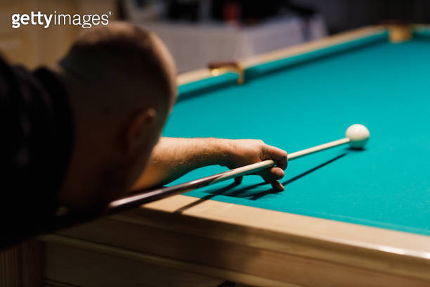 Billiard player at billard table or snooker american billiards pool ...