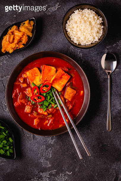 Korean traditional food, spicy kimchi soup (kimchi tige) with pork and ...