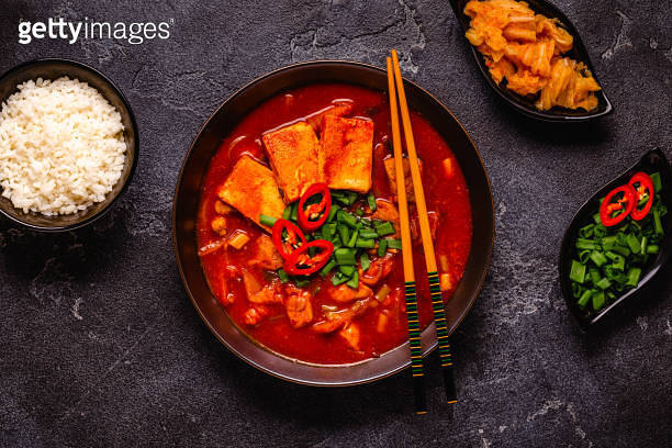 Korean traditional food, spicy kimchi soup (kimchi tige) with pork and ...