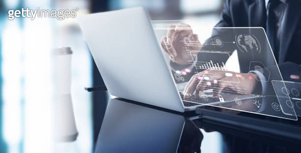 Data scientists. Man programmer using laptop analyzing and develop on information on futuristic ...