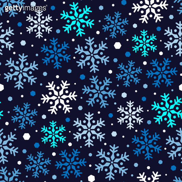 Small beautiful multi-colored snowflakes isolated on a dark blue ...