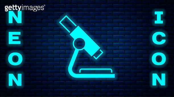 Glowing neon Microscope icon isolated on brick wall background ...