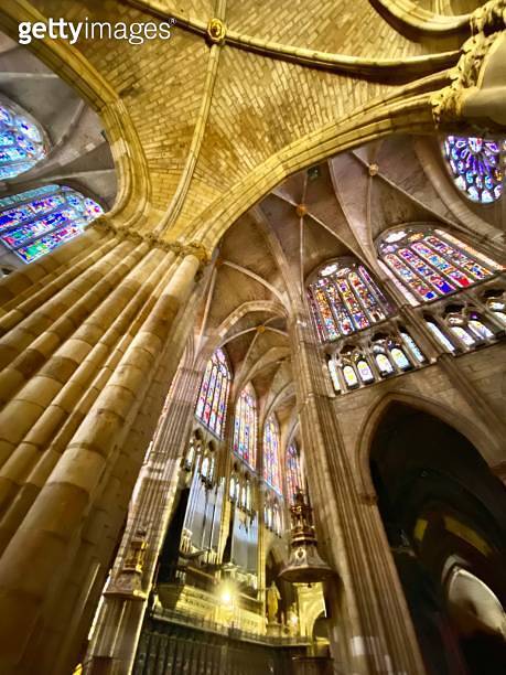 looking directly up at an intersecting groin vault and ogival archways ...