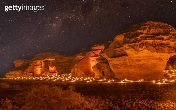 Starlight sky over the ancient nabataean tombs of Hegra city ...