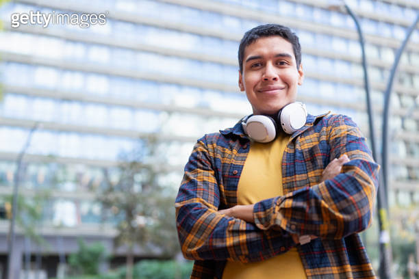 Proud latin student looking with arms crossed in the campus (1849045840 ...