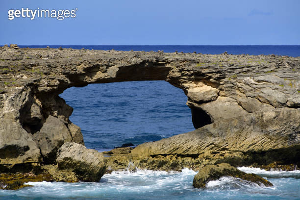 Kukuiho'olua Island with its natural arch, seen from Laie Point, Oahu ...