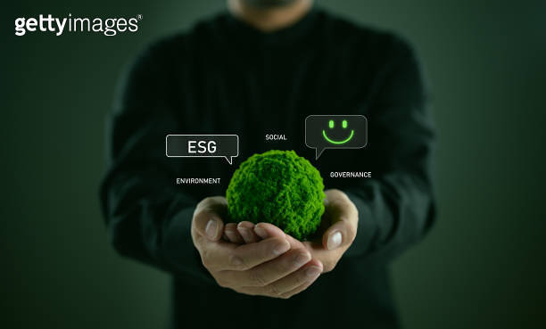 Hand holding green globe with happy smile face and environmental ESG ...