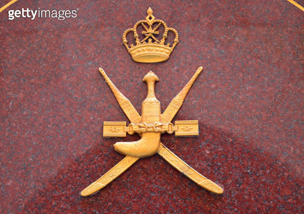 National emblem of Oman - Sultan's Insignia, gold over red granite, Old ...
