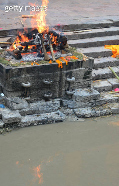 Funeral pyre - open-air cremation by the Bagmati River - antyesti rite ...