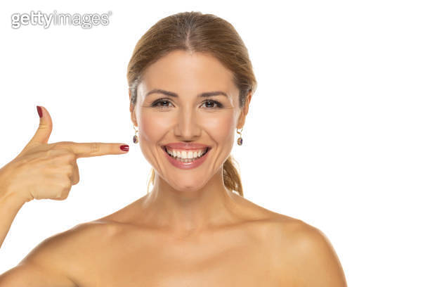 A portrait of a joyful woman with a beautiful smile and tasteful makeup ...