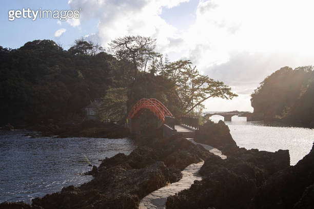 Red bridge conecting volcanic rock formations in Sado Island in Yajima ...