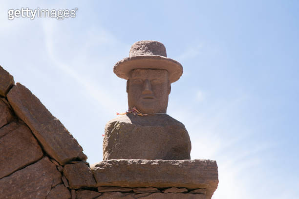 Stone heads carved into the arches on the island of Taquile on Lake ...