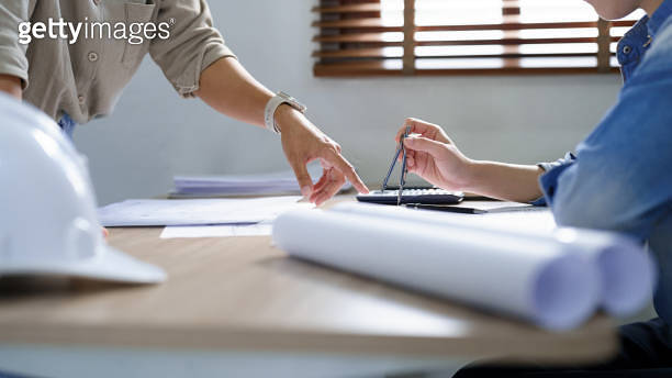 Engineering construction concept, Female engineer use geometry compass ...