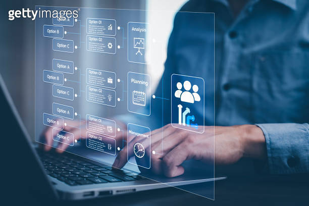 Working on laptops with Planning analysis and Project management online ...