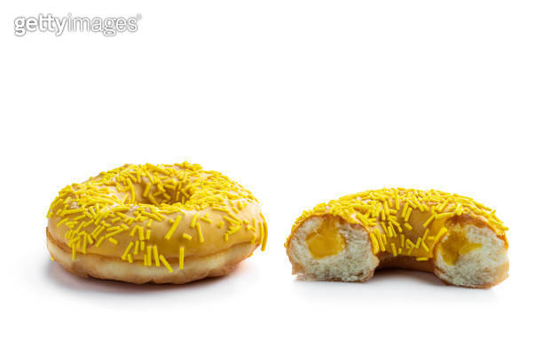 Yellow glazed doughnuts in gray tray isolated on white (1824695808 ...
