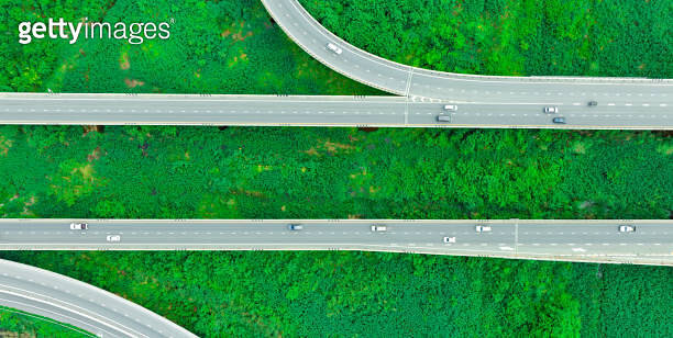 Cars on forest roads and elevated traffic intersections, modern road ...