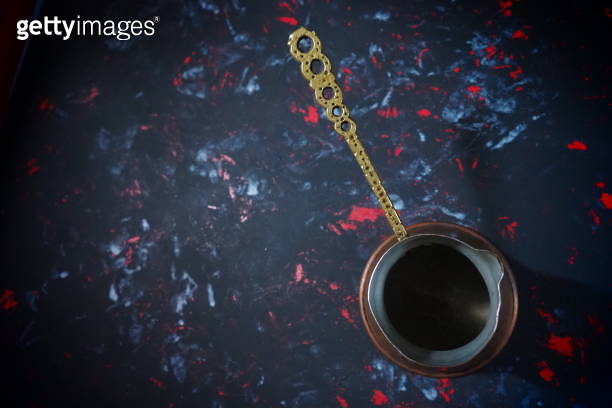 Balkan cezve for turkish coffee. A copper cezve on black surface ...