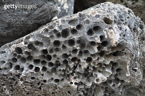 Volcanic stones. Spongy cellular loose airy porous stone material ...