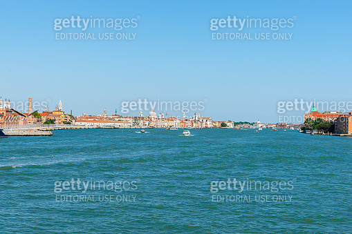 Harbour at Venice with boats and surrounding skyline of buildings,domes ...