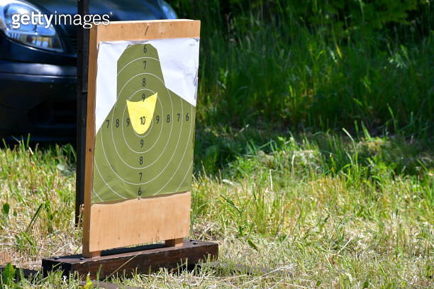 A close up on a shooting range target resembling a person wearing a ...