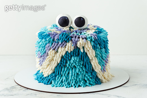 Cute monster cake on the white background. Funny birthday cake with ...