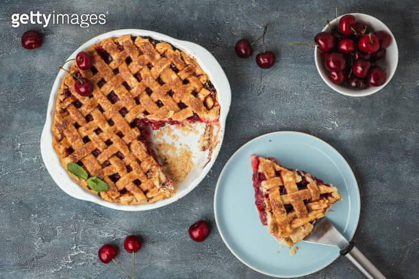 Piece of delicious homemade cherry pie with Flaky Crust sprinkled with ...