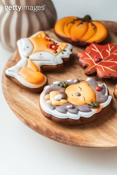 Set of autumn style gingerbread cookies with festive icing in the shape ...