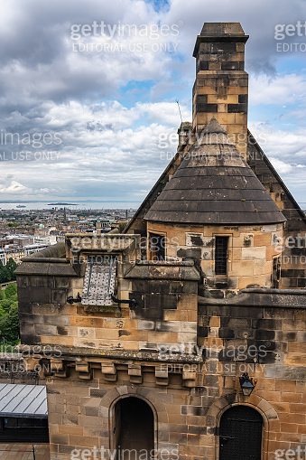 Old stone buildings of Edinburgh Castle overlooking the city in the ...