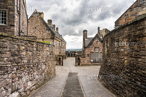 Alley and medieval stone buildings at Edinburgh Castle in the Scottish ...