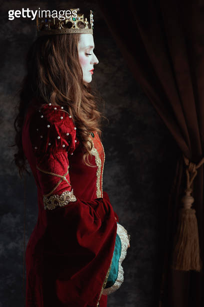 medieval queen in red dress with white makeup and crown (1741068627 ...