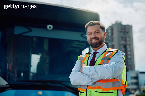 Happy bus driver with arms crossed looking at camera. (1485323605) - 게티 ...