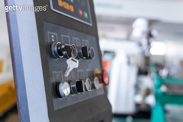 Key on dashboard industrial machine for start or stop in factory or ...