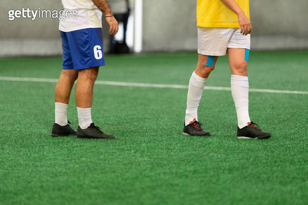 Futsal five-a-side players on artificial grass field indoor. 이미지 ...