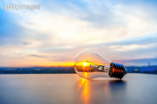 Close-up of Incandescent Light Bulb Against Setting Sun 이미지 (1759271712 ...