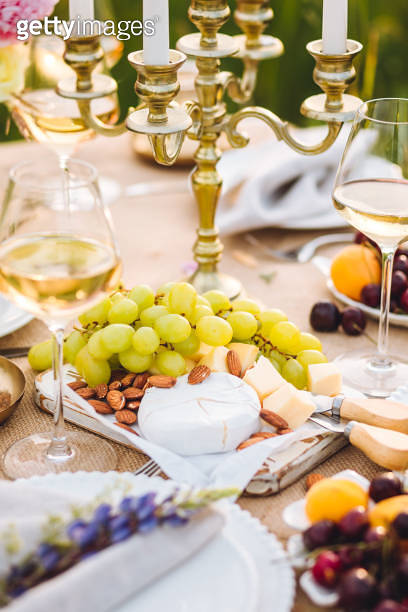 Table honeymoon set for two with luxurious food, glasses of champagne ...