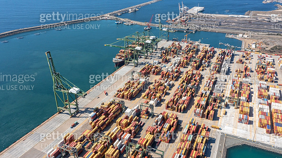 Aerial view of container cargo terminal of commercial port, business ...
