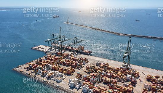 Aerial view of container cargo terminal of commercial port, business ...