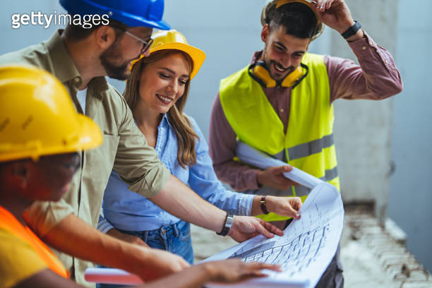 Comparing with the blueprints, a team of experts is evaluating the ...