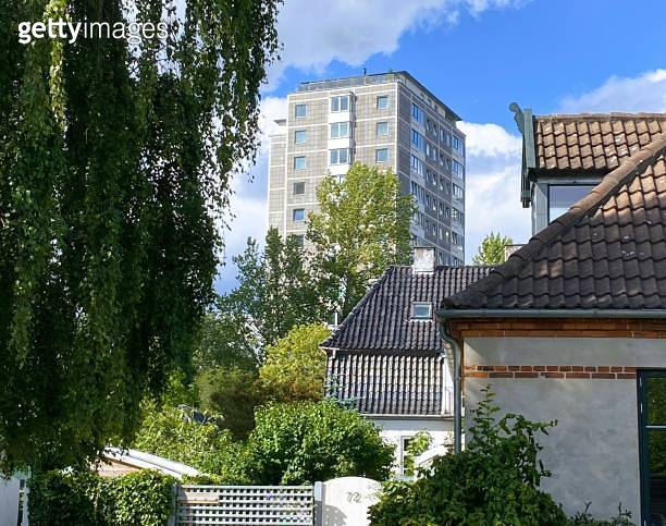 Historic protected townhouse against skyscrapers in Valby, Copenhagen ...