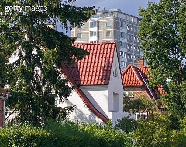 Historic protected townhouses against skyscrapers in Valby, Copenhagen ...