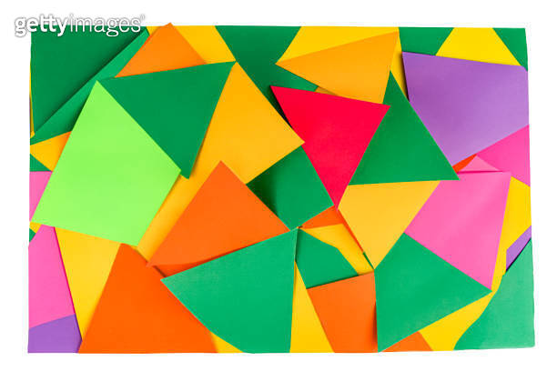 Picture of colored paper cut into colorful triangular geometric shapes ...