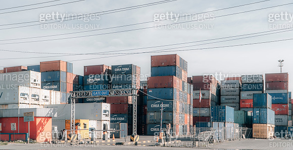 Port Crane at sunset. Harbor container terminal with cranes, containers ...