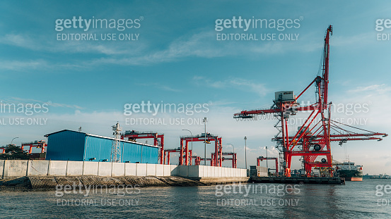 Port Crane at sunset. Harbor container terminal with cranes, containers ...
